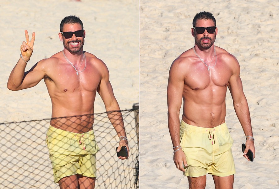 Cauã Reymond ostenta tanquinho em dia de praia no Rio e faz selfie com fã; fotos