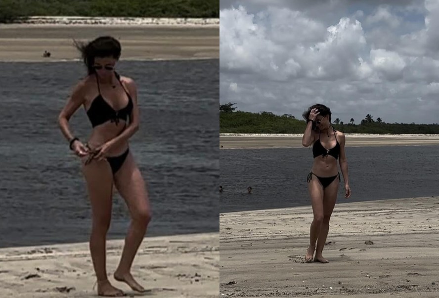 Em cliques raros, Alinne Moraes ignora tempo nublado e posa de biquíni na praia