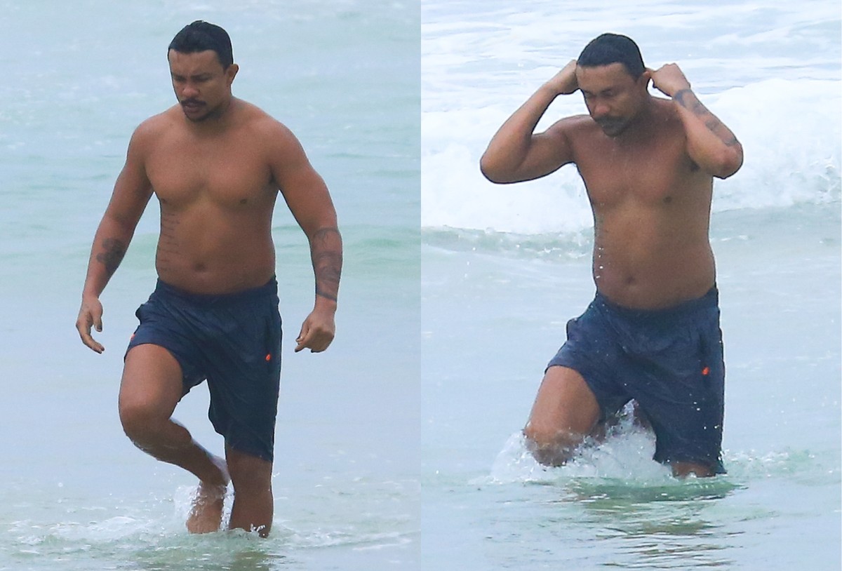 Sem Sophie, Xamã é clicado em mergulho de mar no Rio; veja fotos